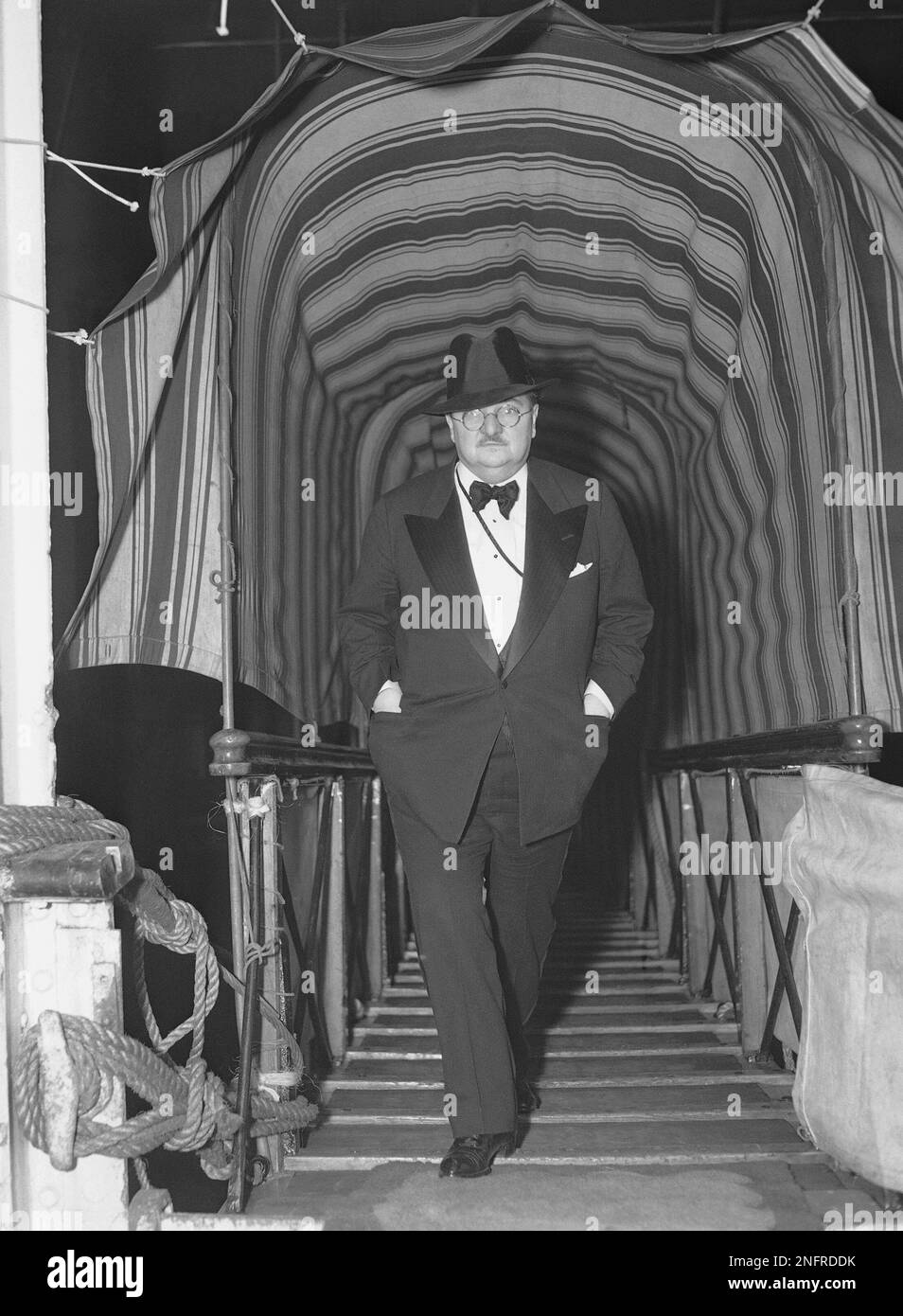 Alexander Woollcott, critic, author and radio commentator, is shown ...