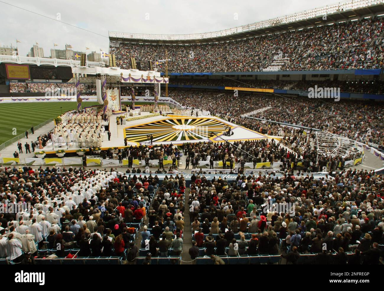 The crowd awaits the arrival of Pope Benedict XVl for a Mass at Yankee ...