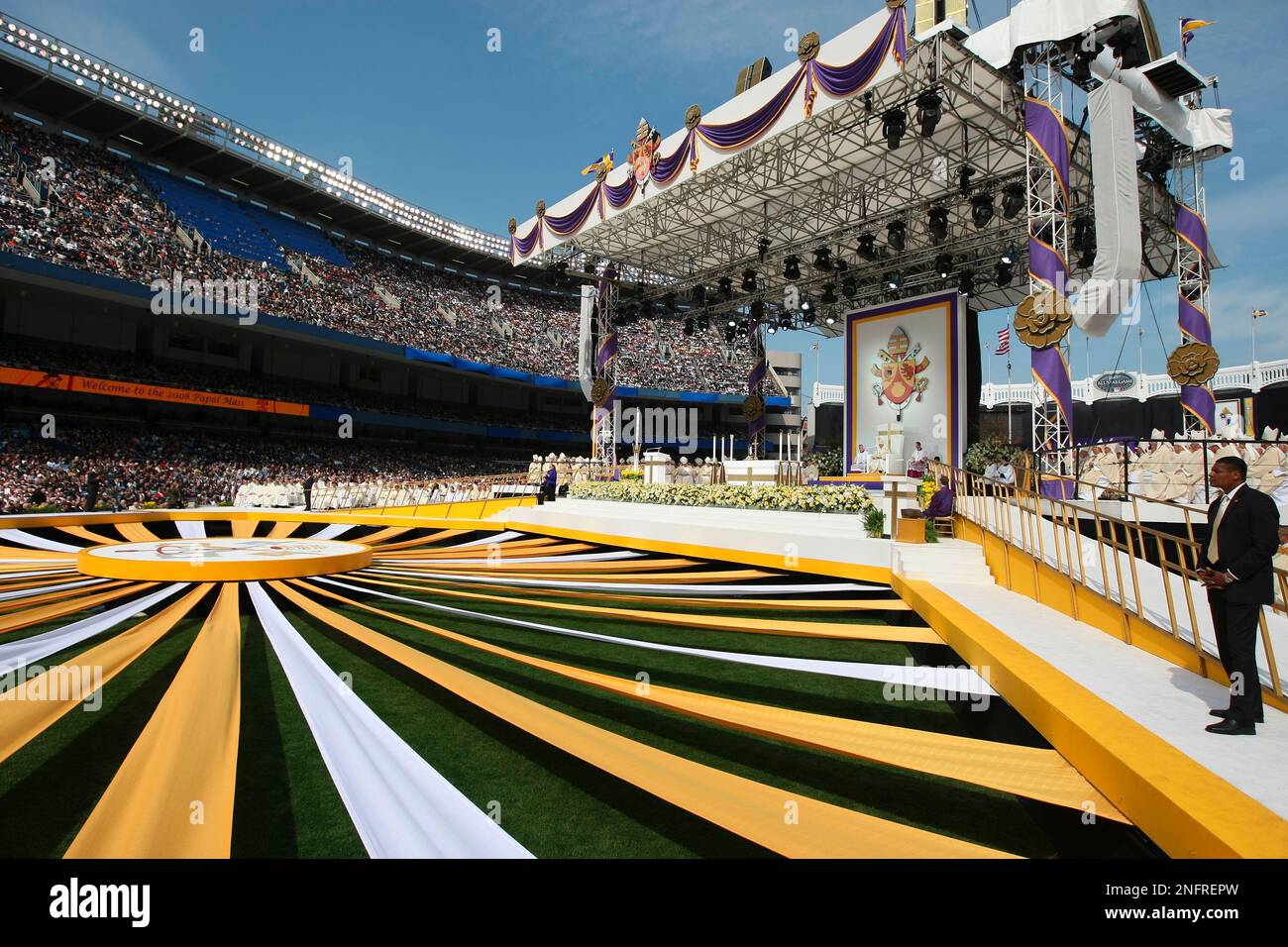 Pope Benedict XVI, seated under the canopy, celebrates a Mass at Yankee ...