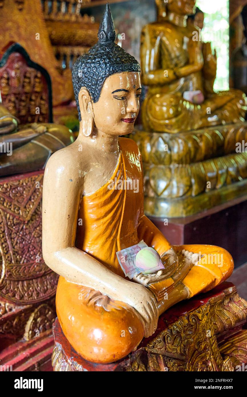 The golden interiors of the Wat Phnom Temple in Phnom Penh, Cambodia ...