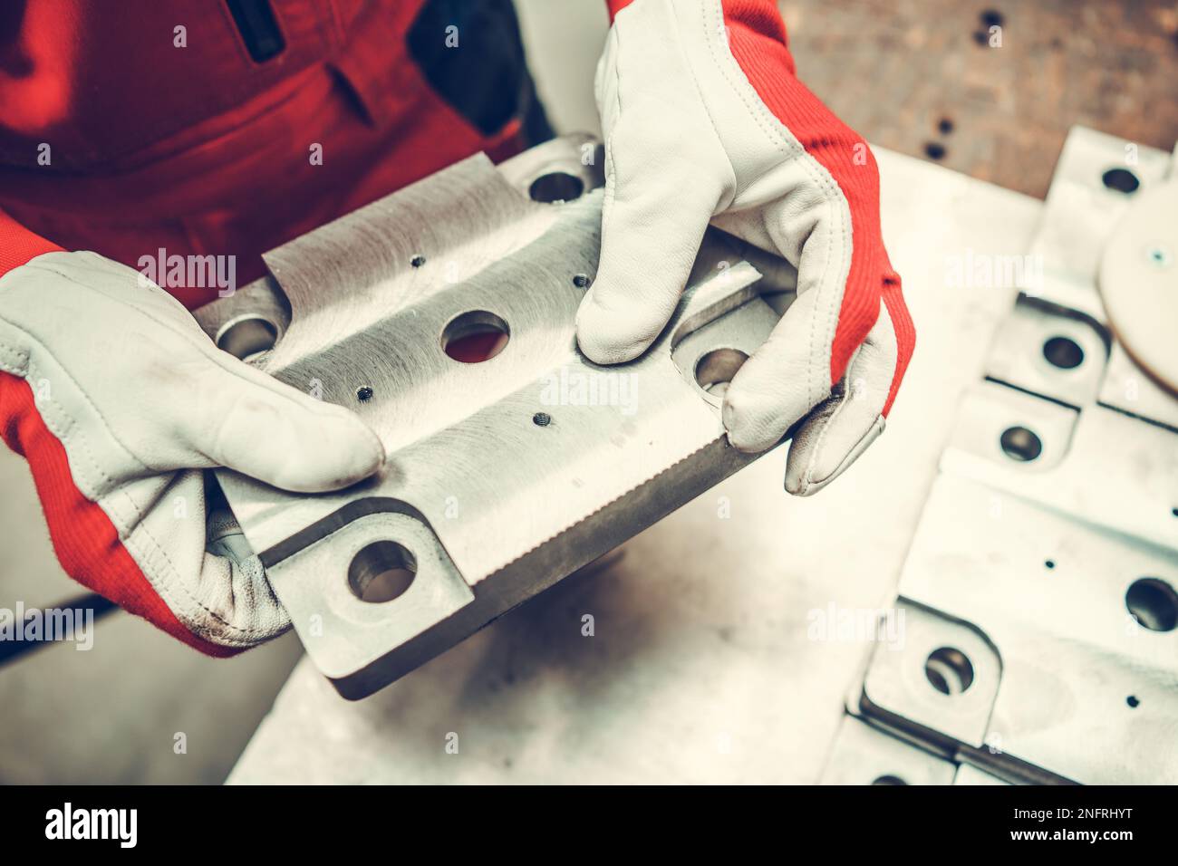 Production Supervisor Carrying Out Quality Check on Metal Components ...