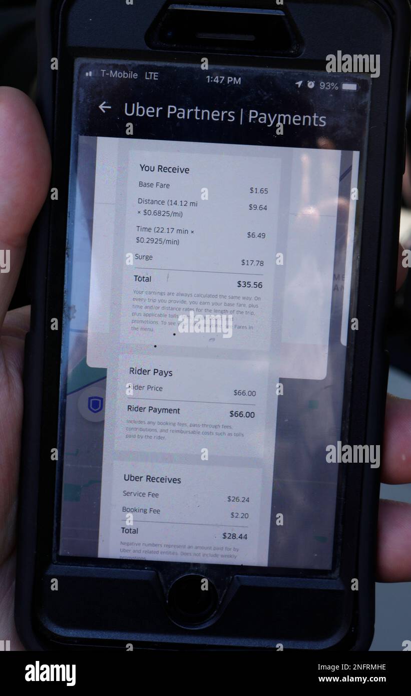 Uber driver Jeff Perry display the money breakdown for one of his ...