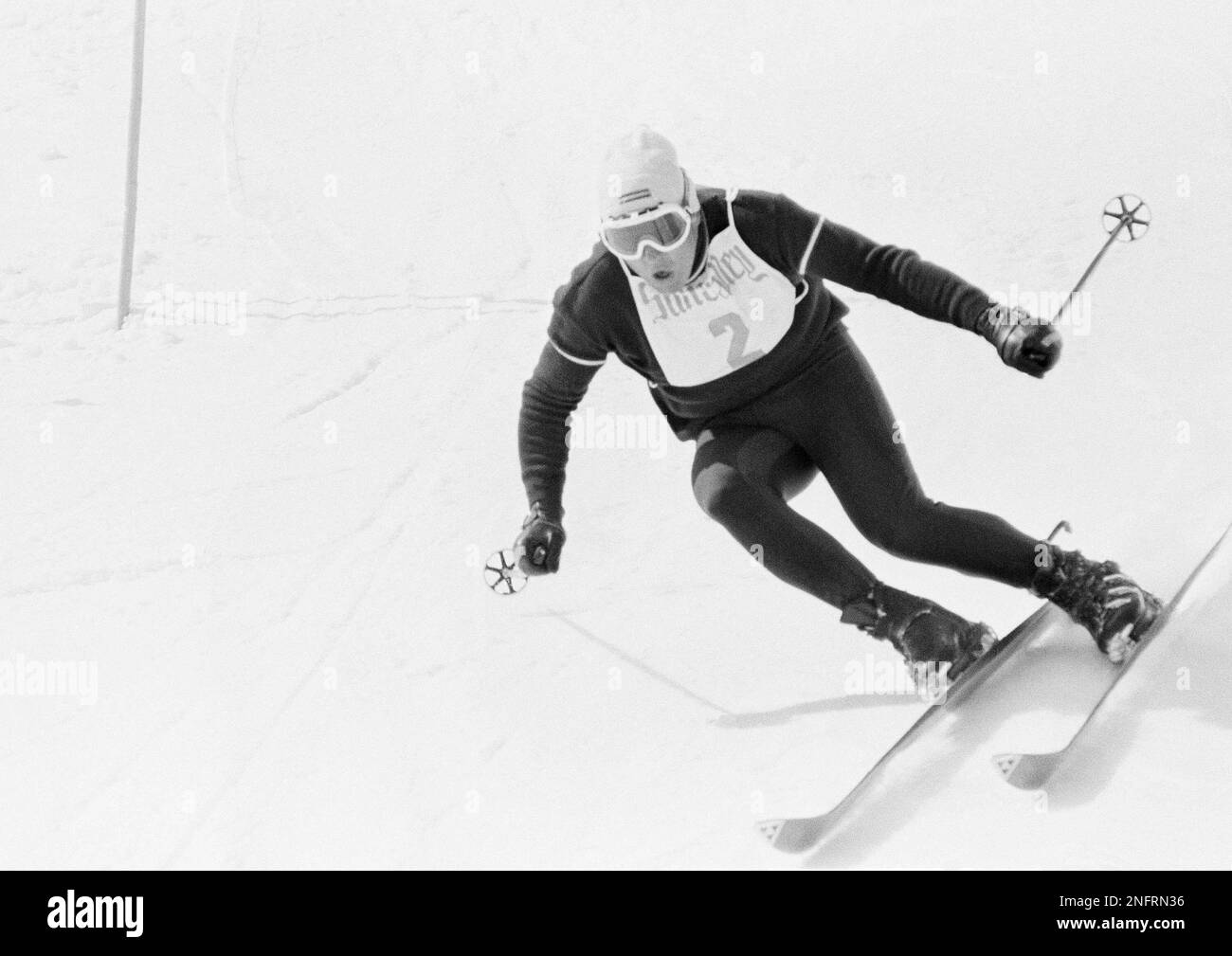 Jean-Claude Killy his racing bib reversed, rips through the final gate ...