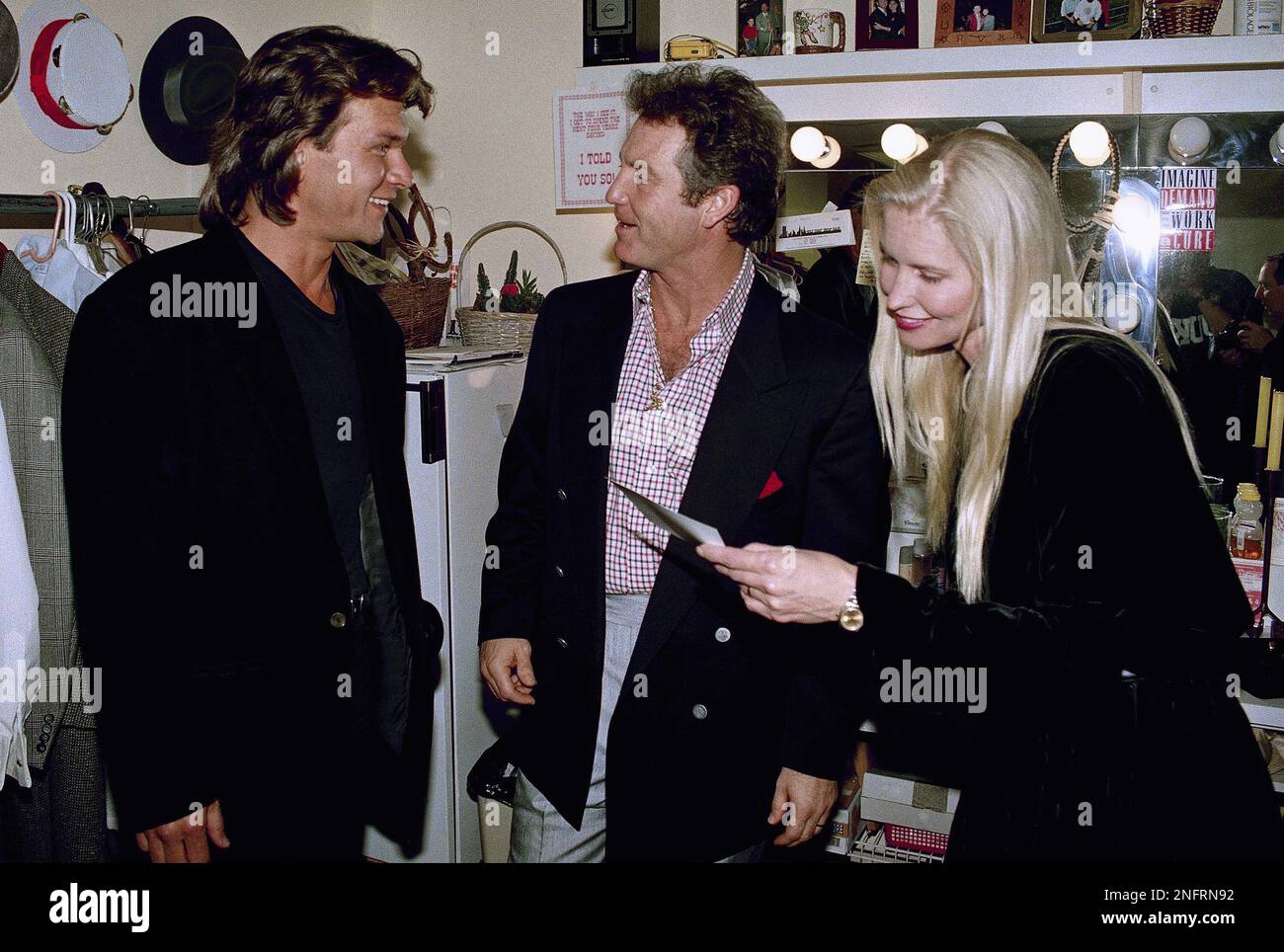 Actor Patrick Swayze, left, and his wife Lisa Niemi, right, pay a ...
