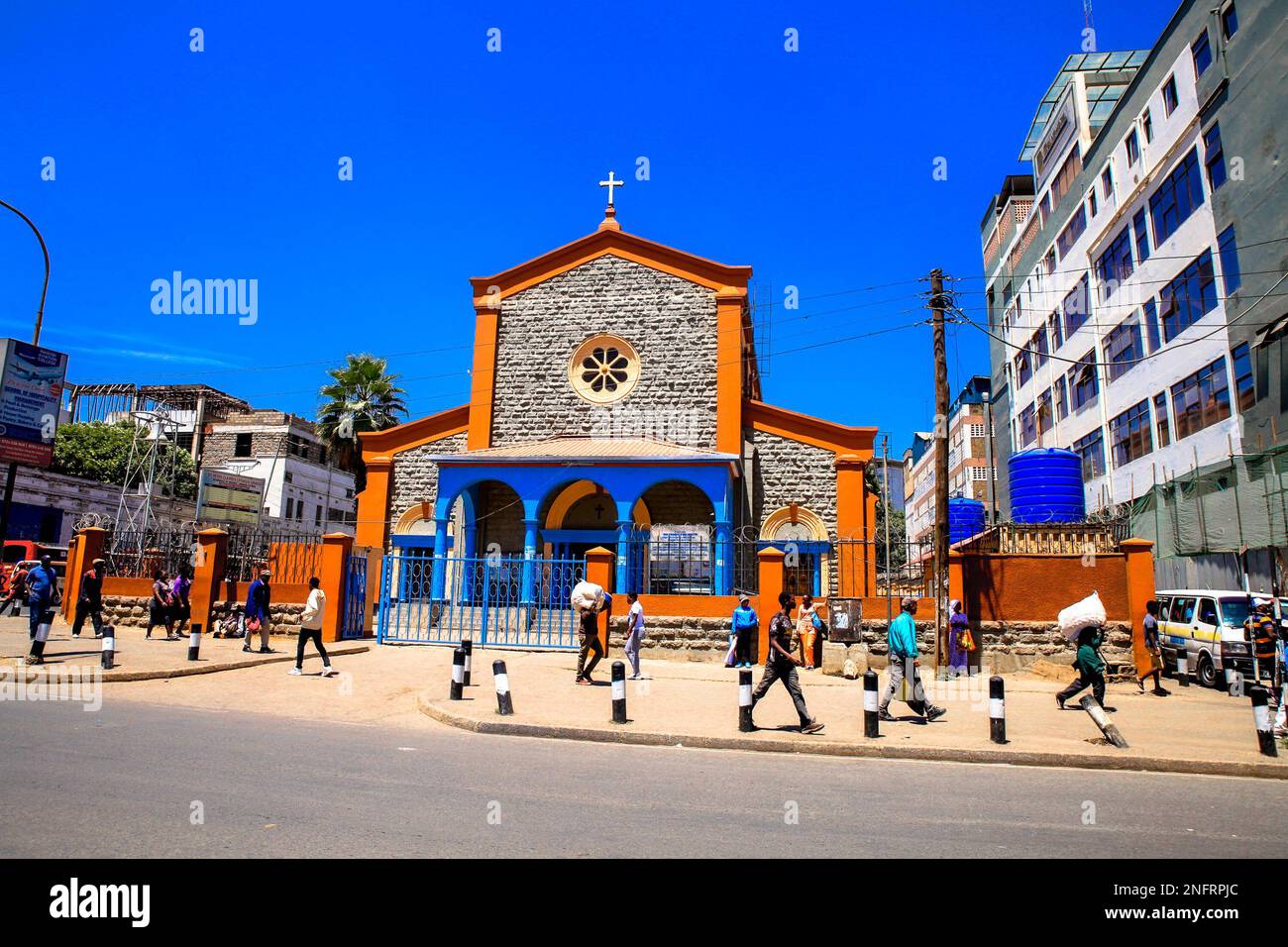 Pedestrians walk past St Peters Clavers Catholic Church in Uyoma ...