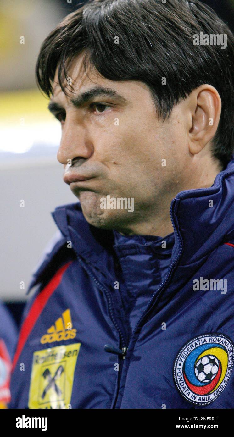 Romania's head coach Victor Piturca looks on before a friendly soccer ...