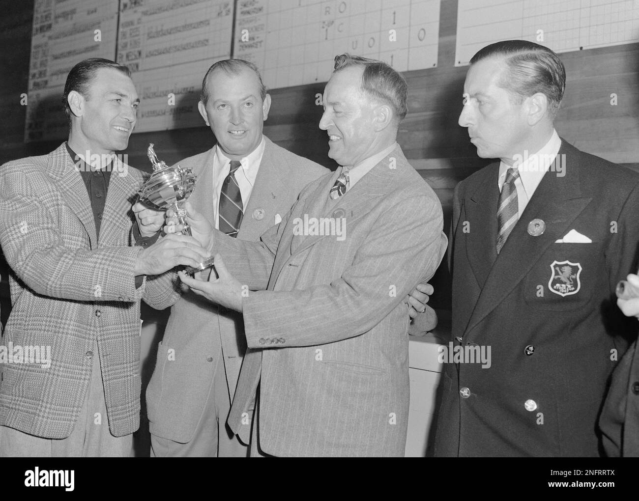 Ben Hogan (left), captain of the U.S. Ryder Cup Team, receives a Gold ...