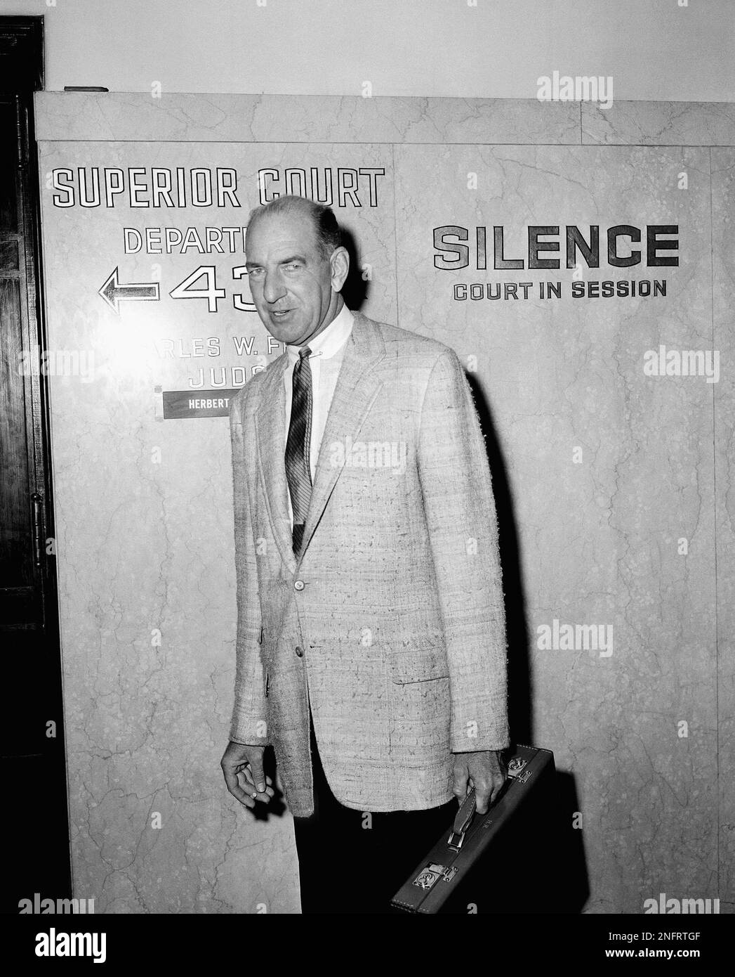 Howard Rushmore, former editor of Confidential magazine, at libel trial ...
