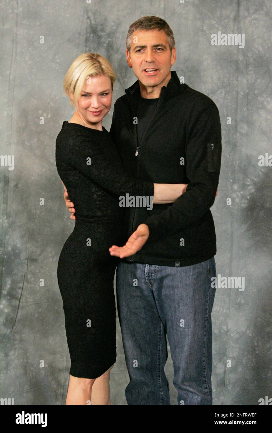U.S.-born actress Renee Zellweger poses with actor George Clooney ...