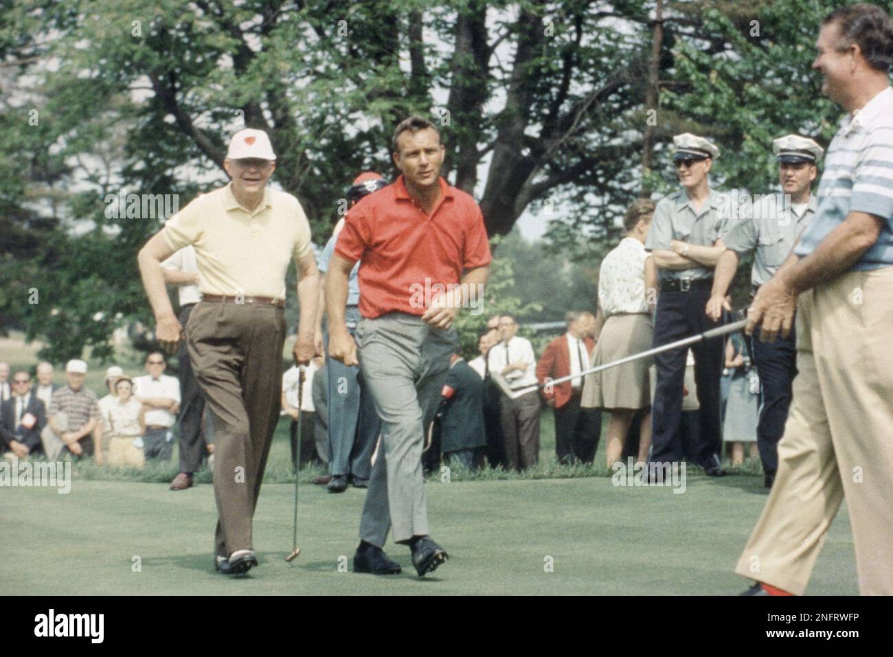 U.S. President Dwight D. Eisenhower , left, is seen with his partner ...