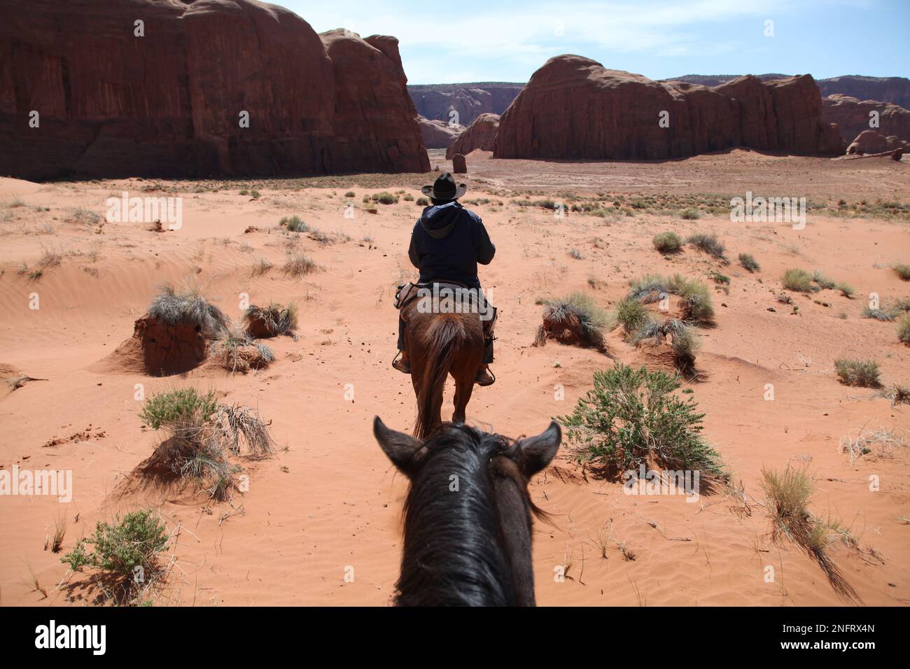 Horseback riding in Monument Valley on the Utah Arizona state line in ...