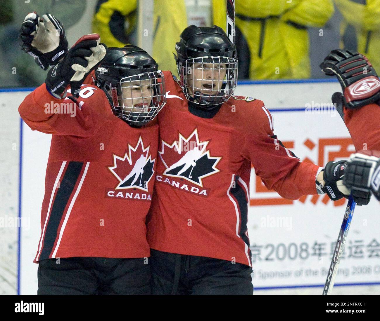 Team Canada forward Sarah Vaillancourt, left, celebrates the first of ...