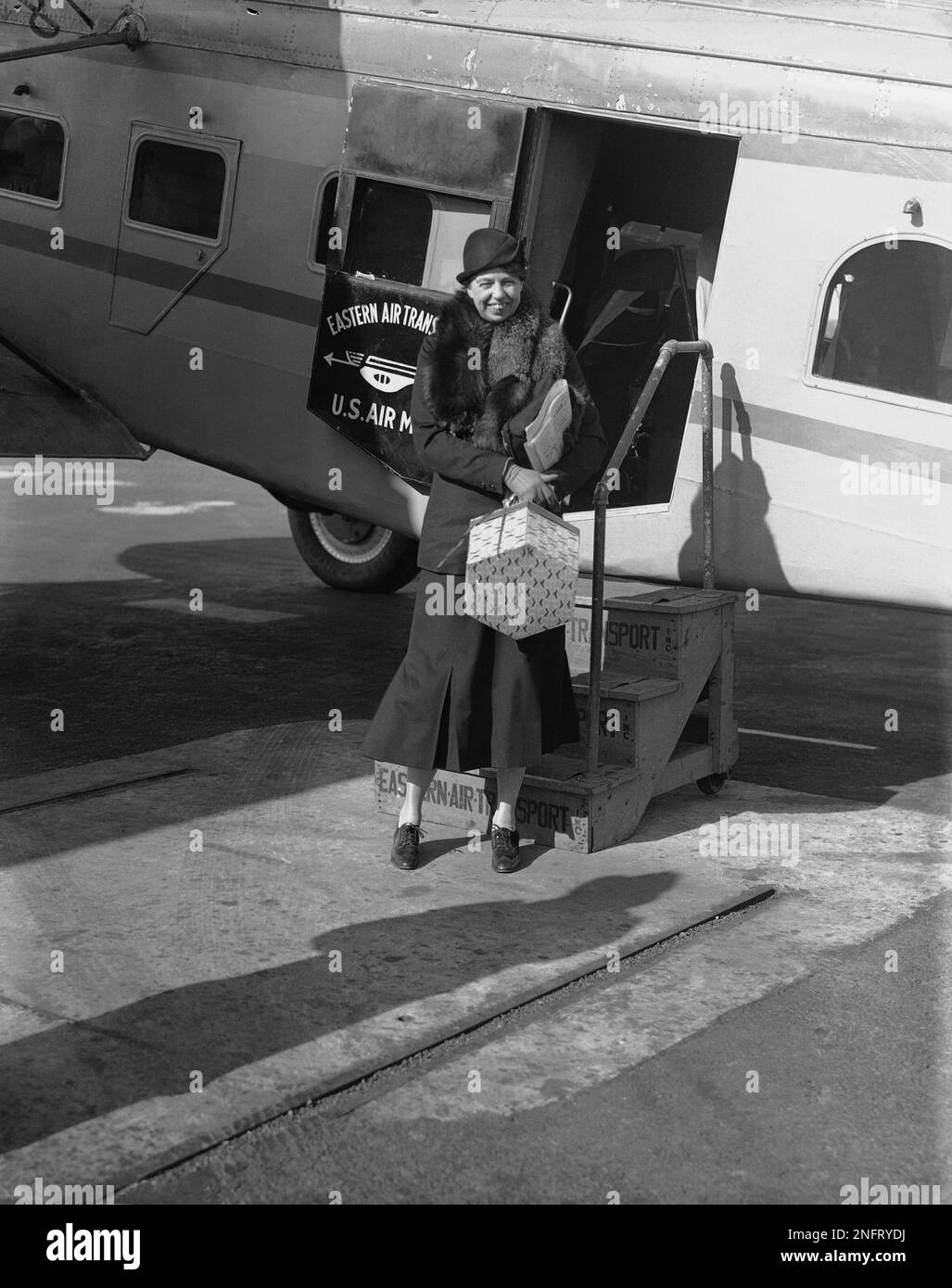First Lady Eleanor Roosevelt is shown in front of the plane in which ...