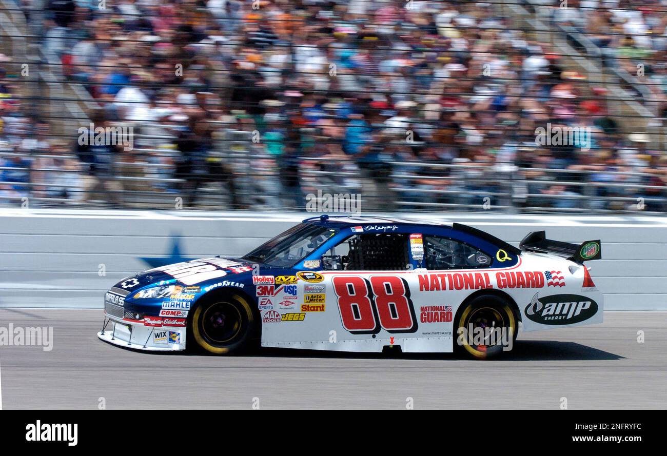 NASCAR driver Dale Earnhardt Jr. drives his car through turn four ...