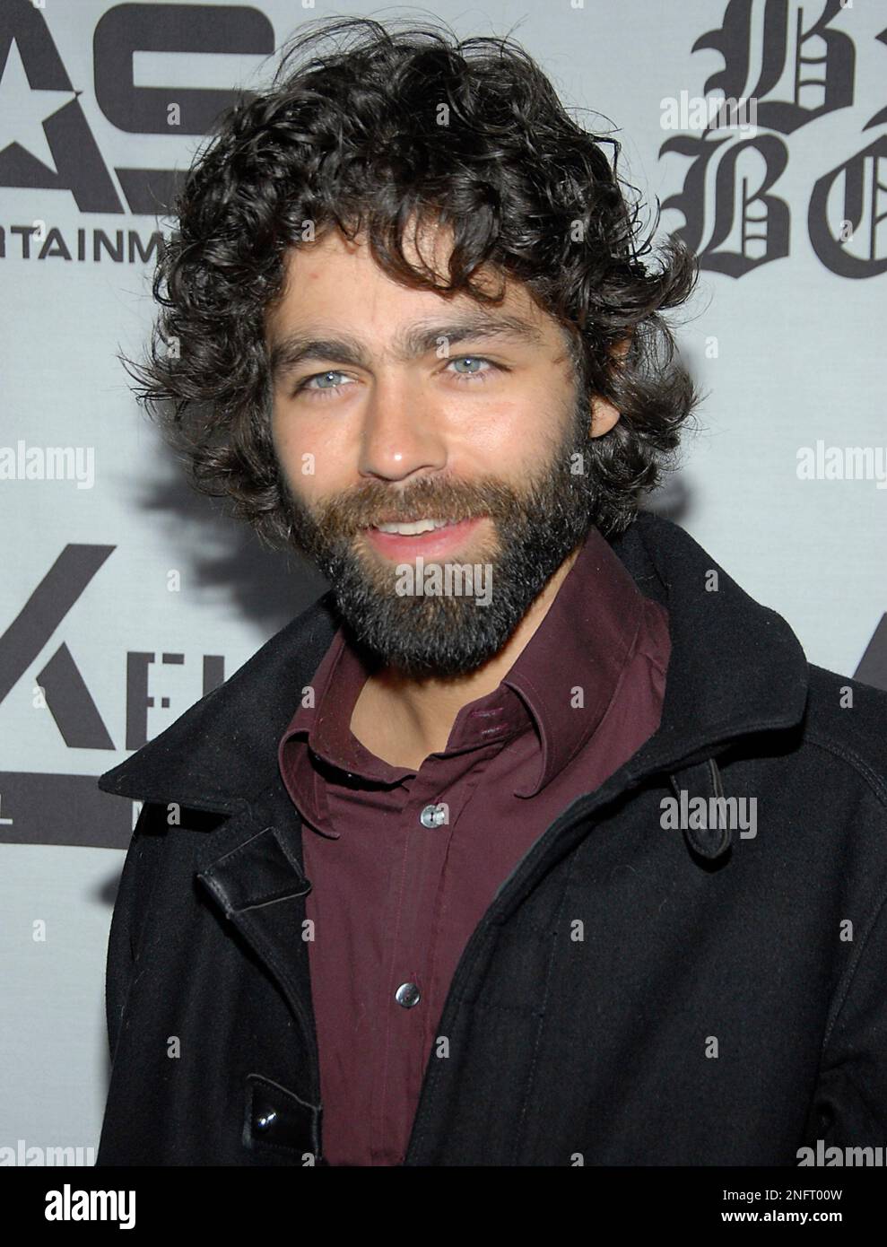 Actor Adrian Grenier poses on the press line at the premiere of "Bra ...
