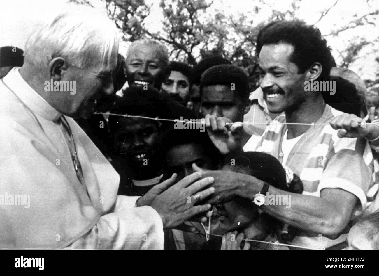 Pope John Paul II blesses a local native after his arrival at Sal, in ...