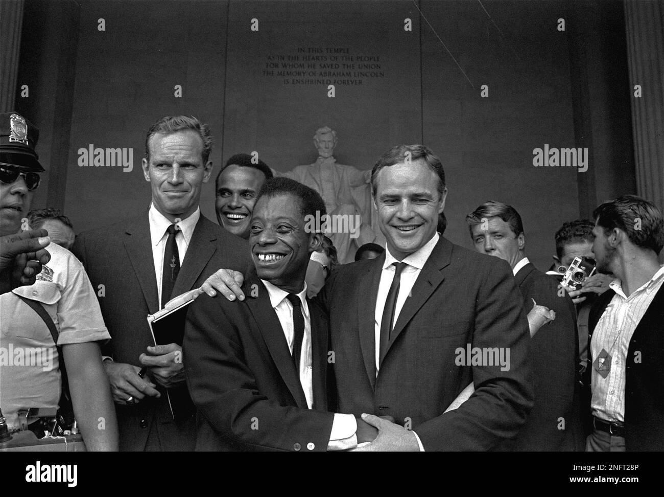 FILE *** Actor Marlon Brando, right, poses with his arm around James ...