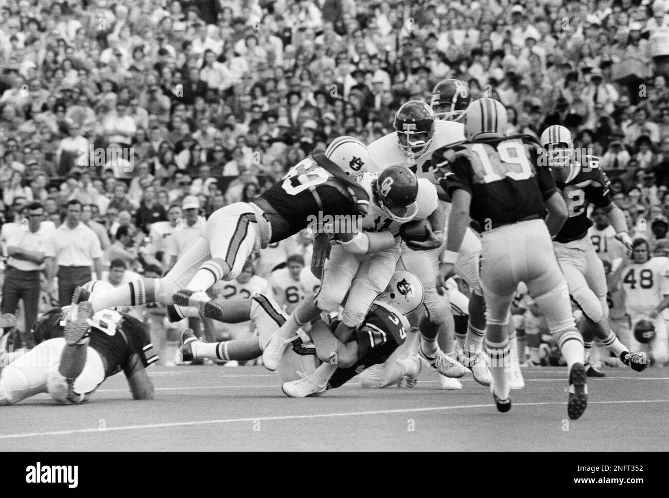 Auburn's Tommy Yearout (69) makes a flying tackle on Oklahoma ...