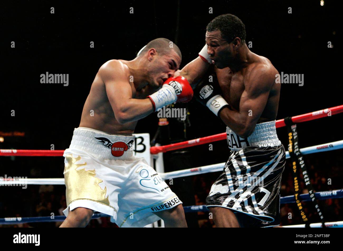 Miguel Cotto, left, and Shane Mosley spar during the WBA welterweight ...