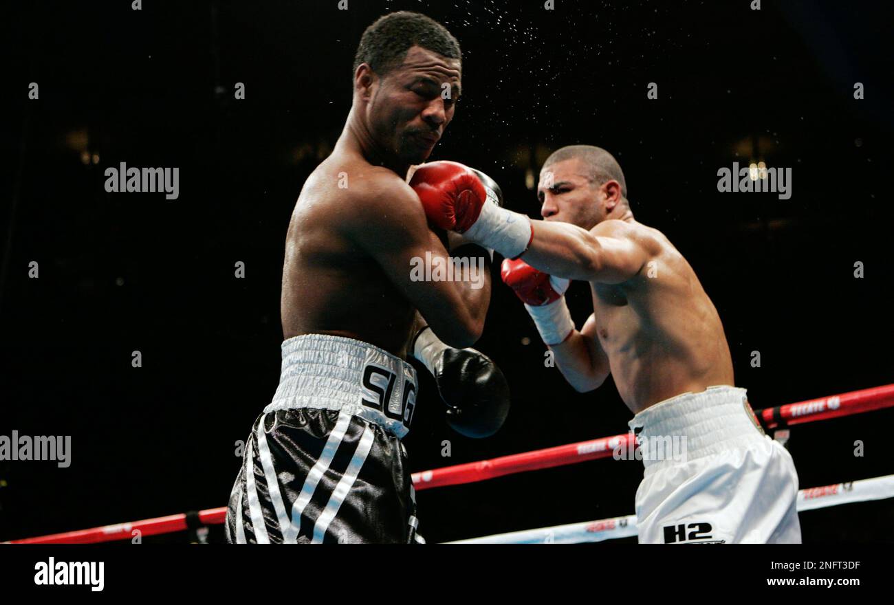Miguel Cotto, right, connects with Shane Mosley during the WBA ...