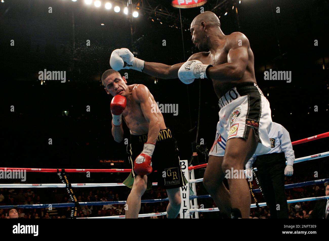 Joel Casamayor, right, and Jose Armando Santa Cruze spar during the WBC ...
