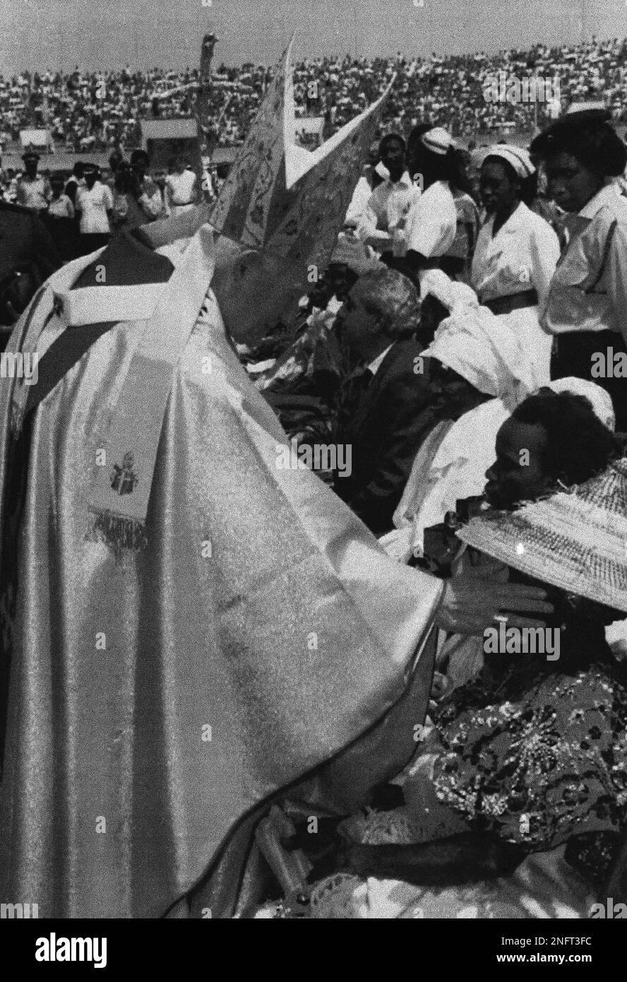 Pope John Paul II blesses the sick and infirm at a papal Mass in Banjul ...