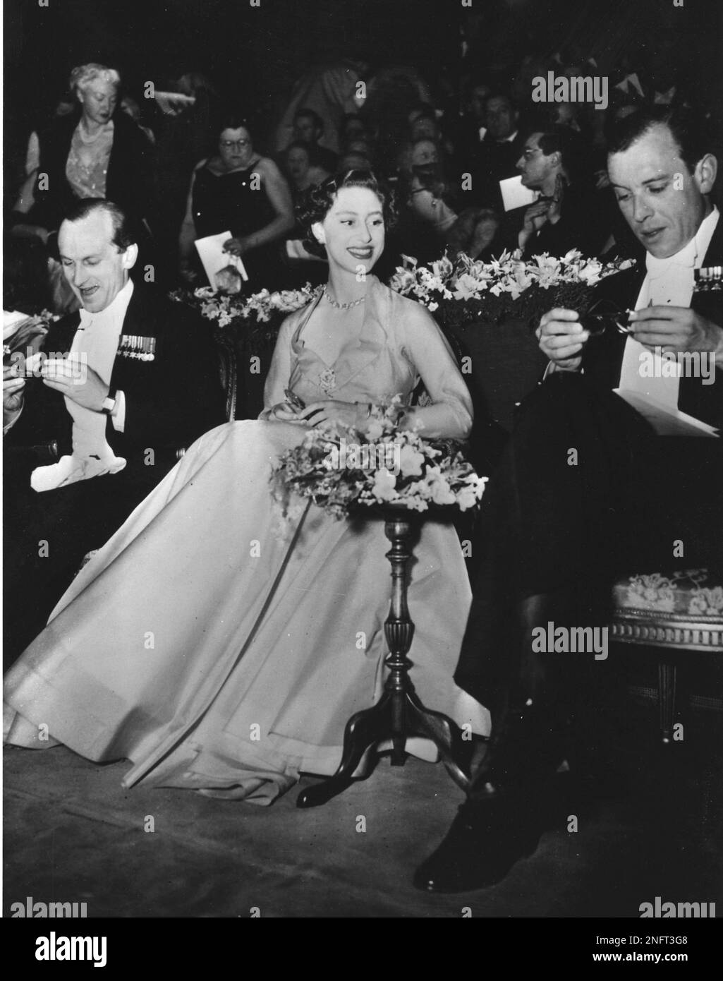 Princess Margaret is flanked by Denys Rhodes, right, and Bonham Carter ...