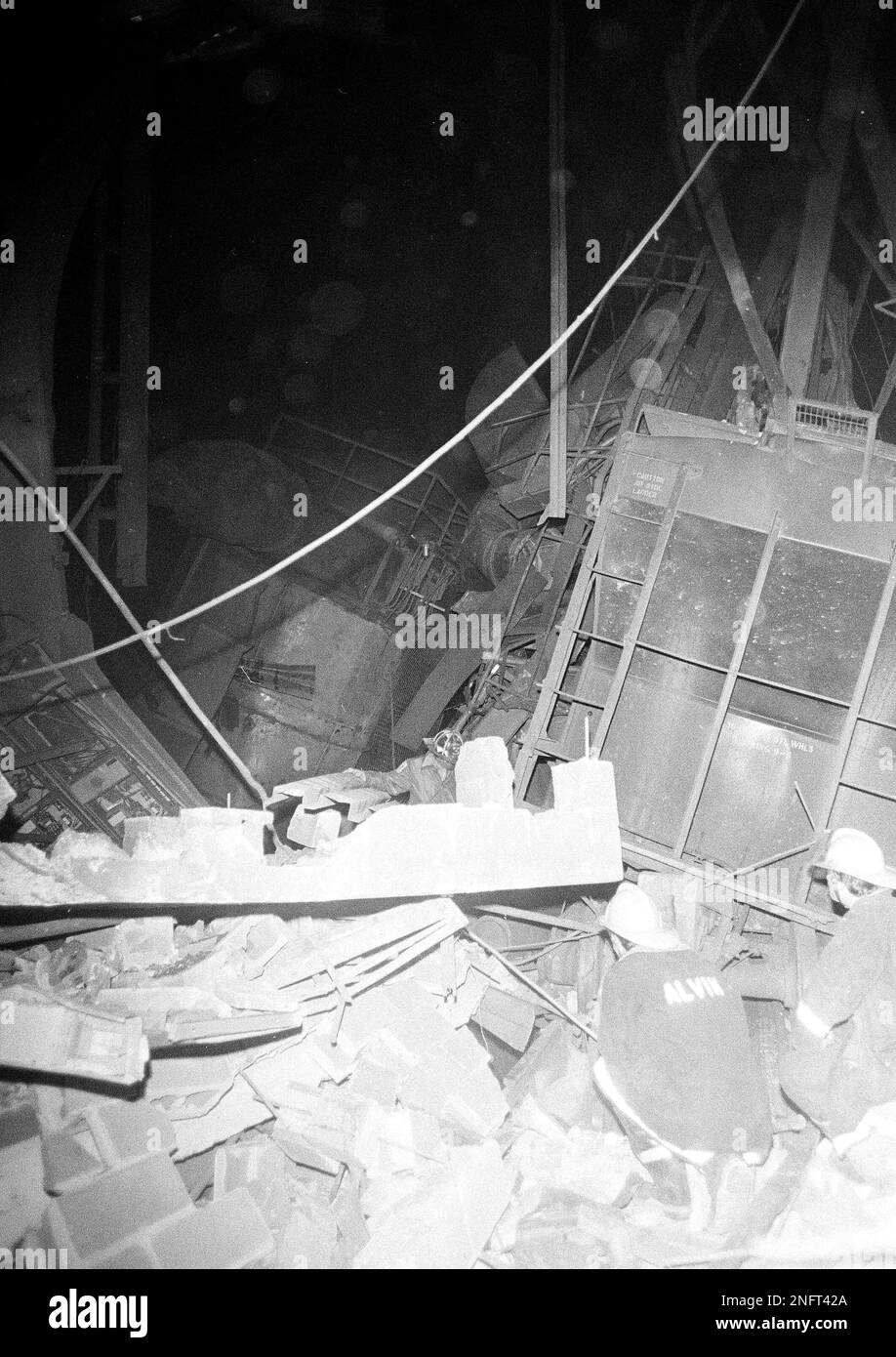 Fireman search under rubble left after an explosion roared through a ...