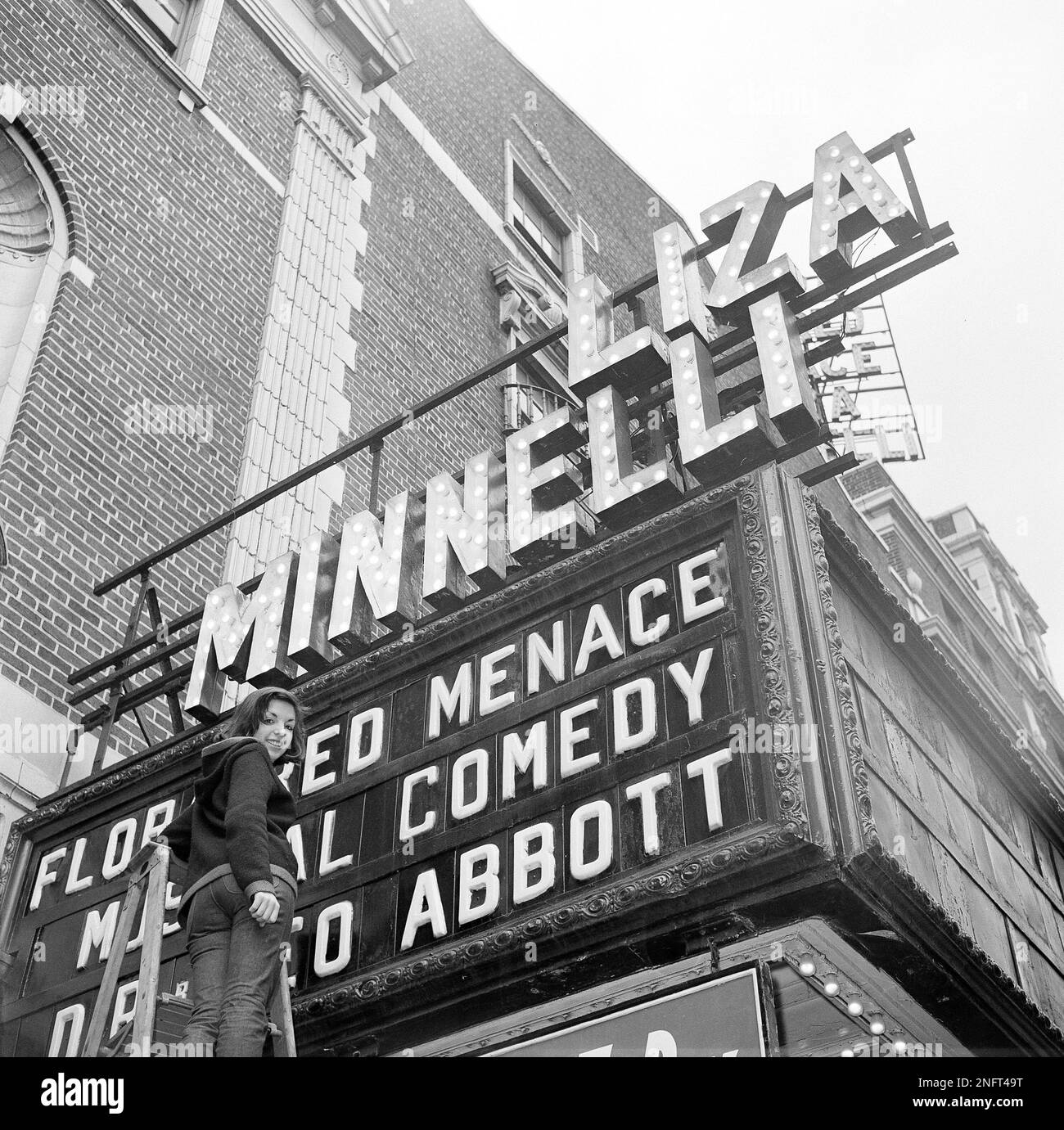 Entertainer Liza Minnelli poses on a ladder after her name was put in ...