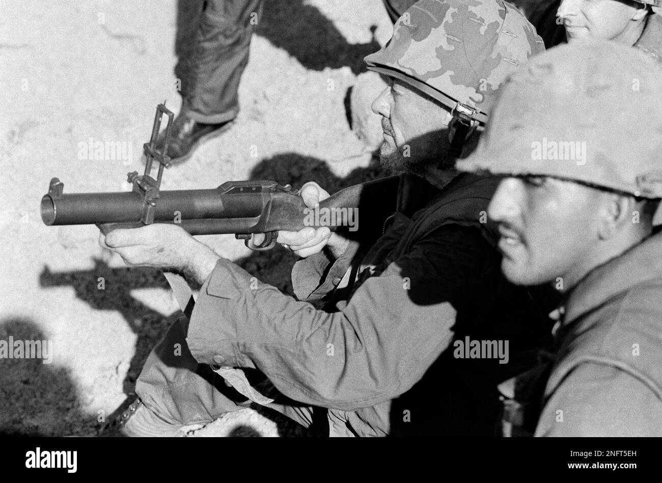 American author John Steinbeck, left, fires an M79 grenade launcher as ...