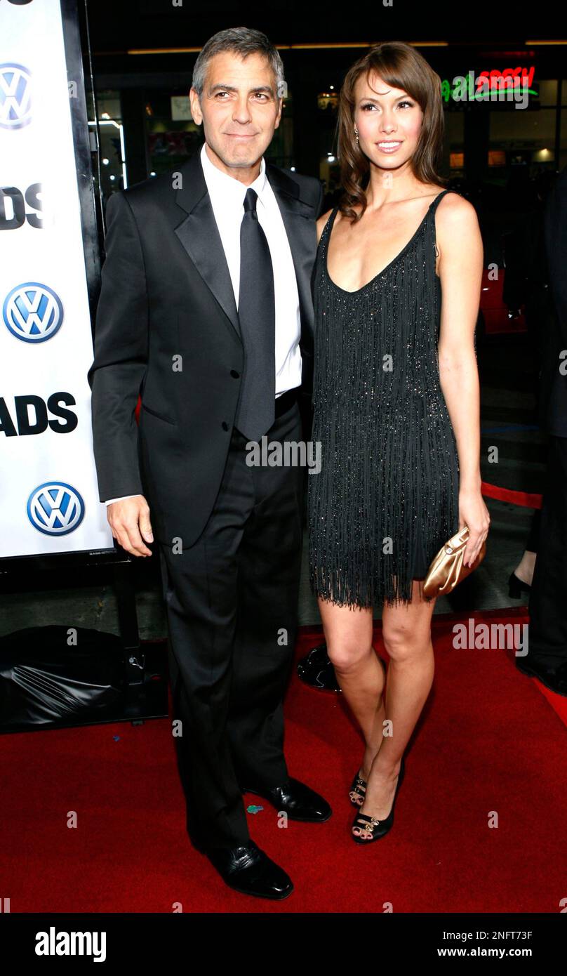 George Clooney, left, and Sarah Larson arrive at the premiere of ...