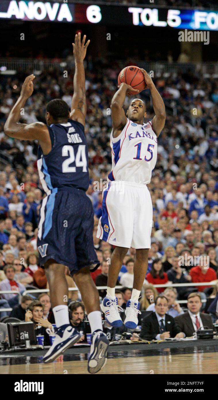 Kansas's Mario Chalmers (15) shoots over Villanova's Corey Stokes ...