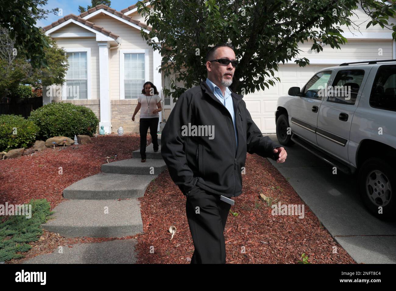 Two people from the Solano County public defenders office are seen ...
