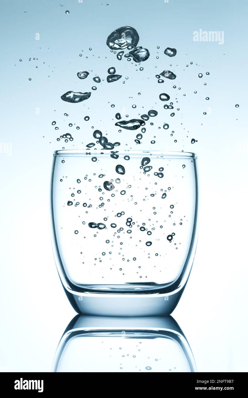 Glass full of bubbles with light blue gradient background Stock Photo ...