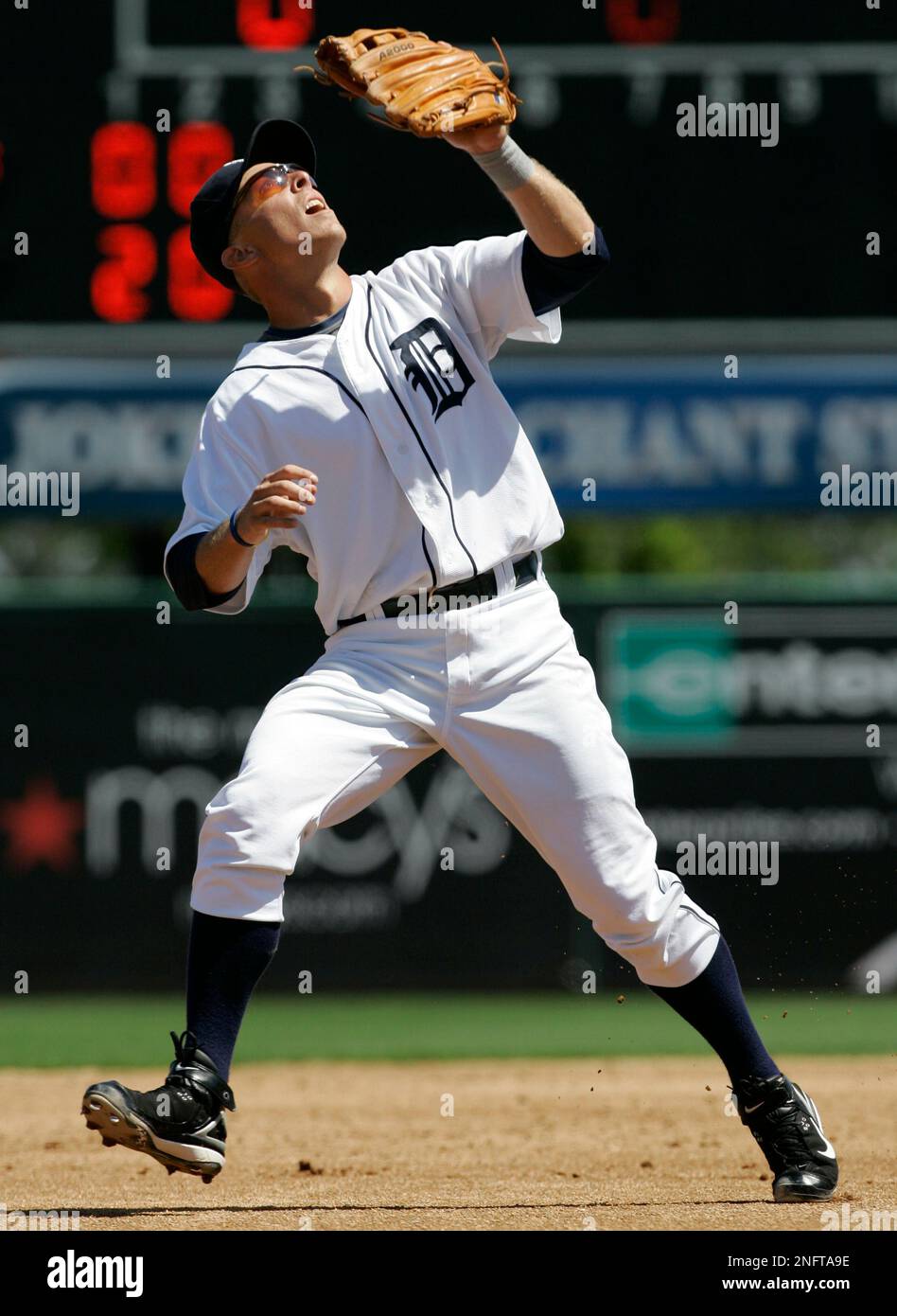 Detroit Tigers infielder Brandon Inge fields a fly ball against the ...