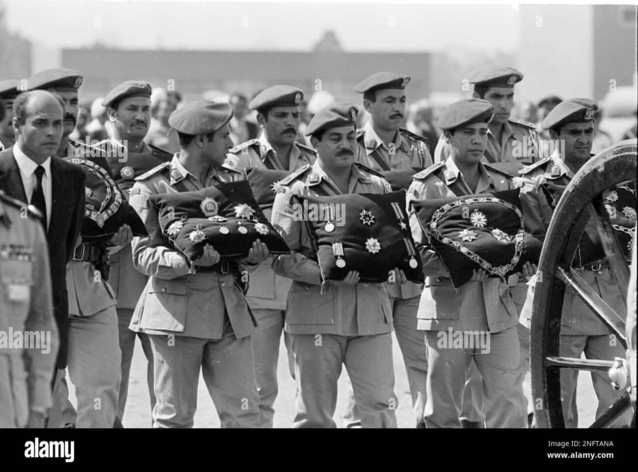 Egyptian soldiers carry the medals of slain President Anwar Sadat in ...