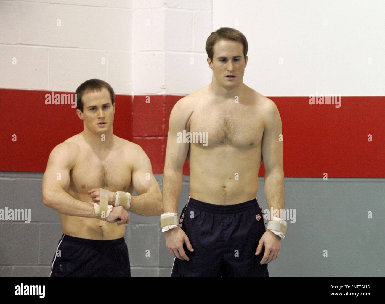 Morgan Hamm, right, gets ready to practice his floor routine as his ...