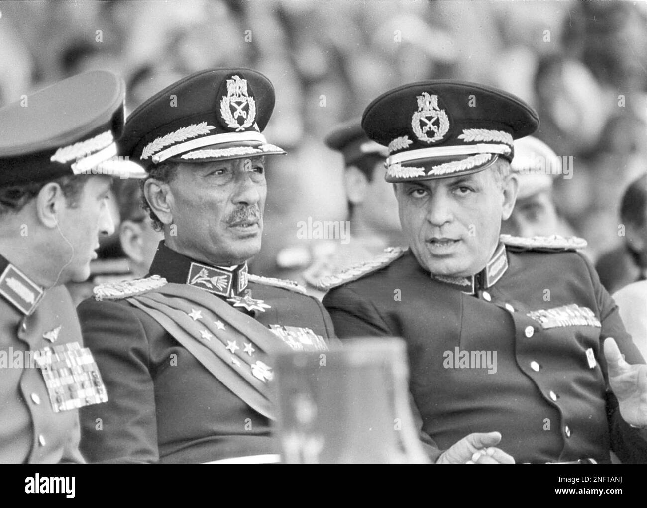 Egyptian President Anwar Sadat, center, speaks to Egyptian Minister of ...