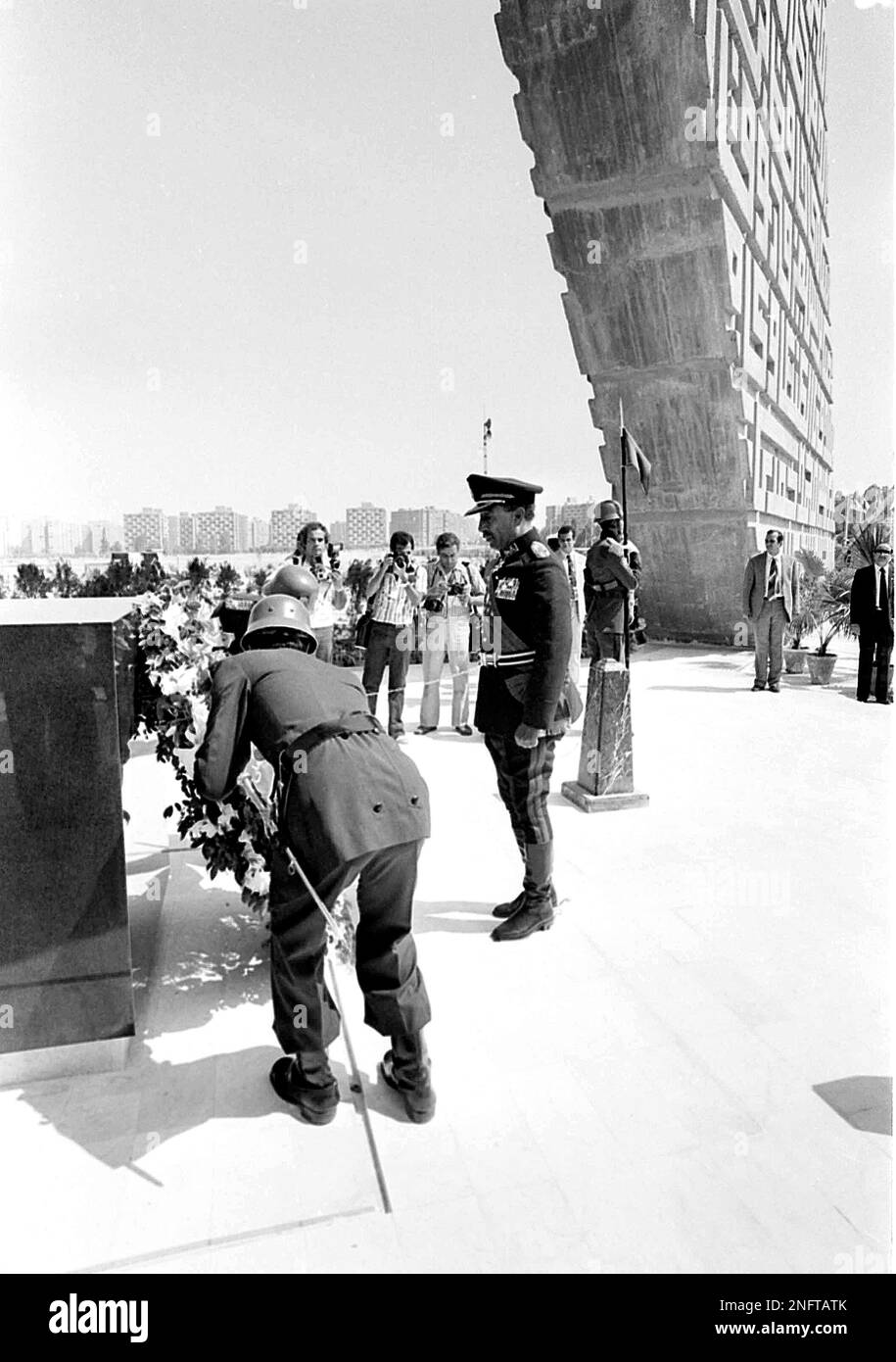 Egyptian President Anwar Sadat, center, stands before tomb of Egypt's ...