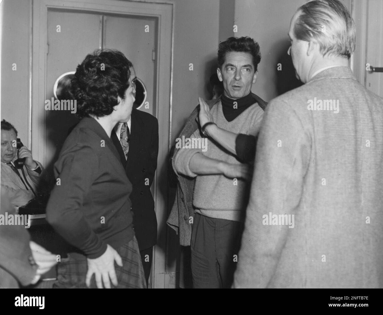 Austrian conductor Herbert von Karajan ,center, dicusses arrangements ...
