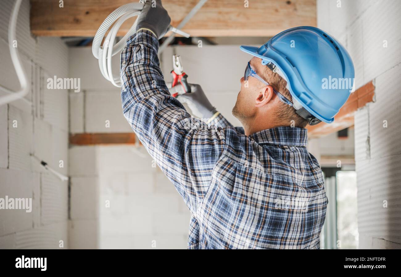 Closeup of Professional Caucasian Electrician Installing Electrical ...