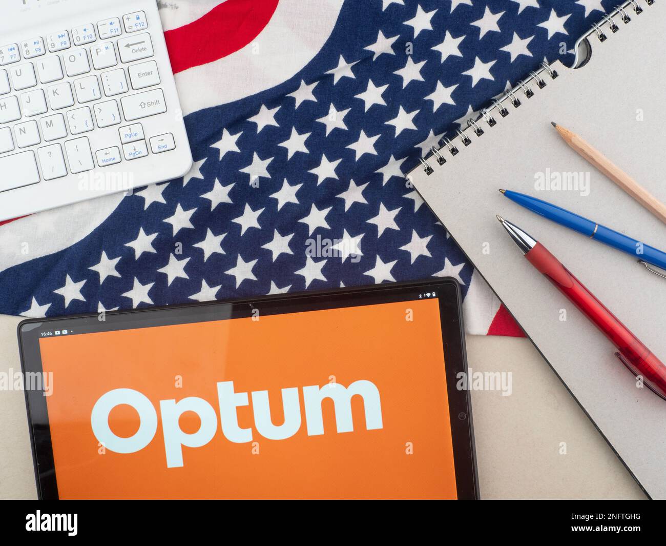 In this photo illustration, Optum, Inc. logo seen displayed on a tablet ...