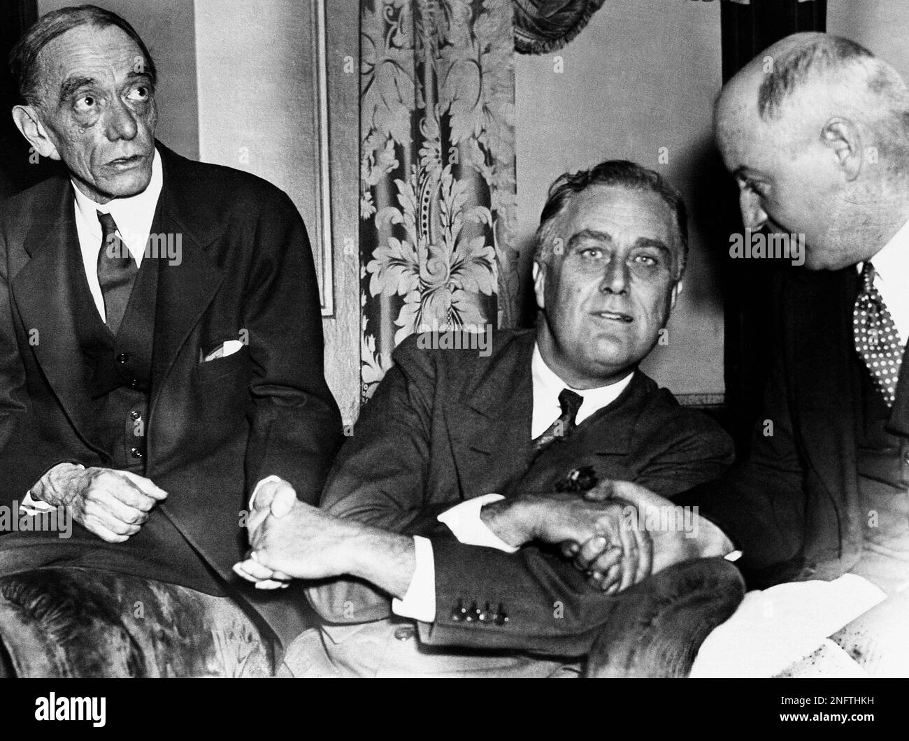 Franklin D. Roosevelt, center, poses for Louis Howe, left, a chief ...