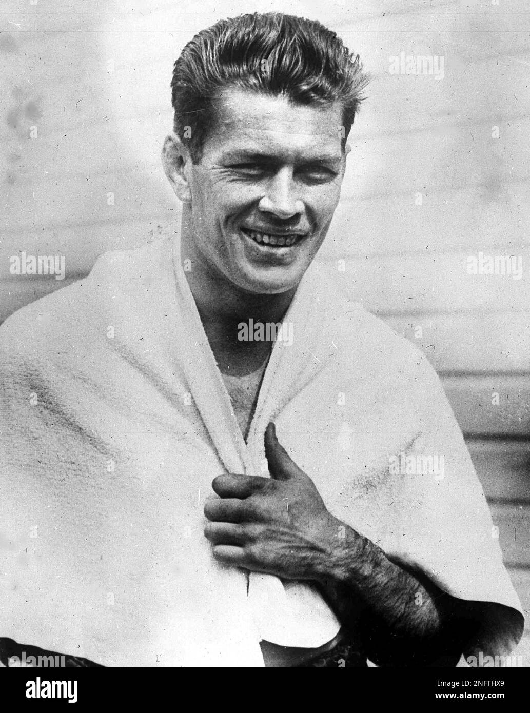 American Gene Tunney, the World Heavyweight Champion, smiles at ...