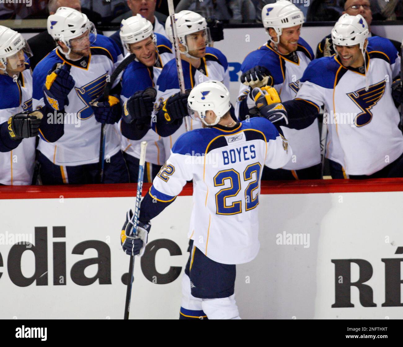 St. Louis Blues' Brad Boyes is congratulated by teammates after scoring ...