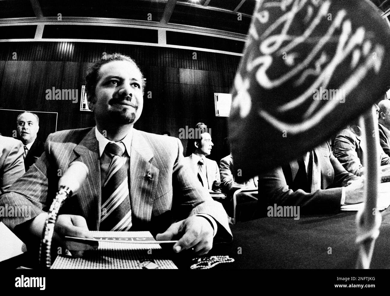 Saudi Arabia's oil minister Sheikh Ahmed Zaki Yamani sits beside his ...