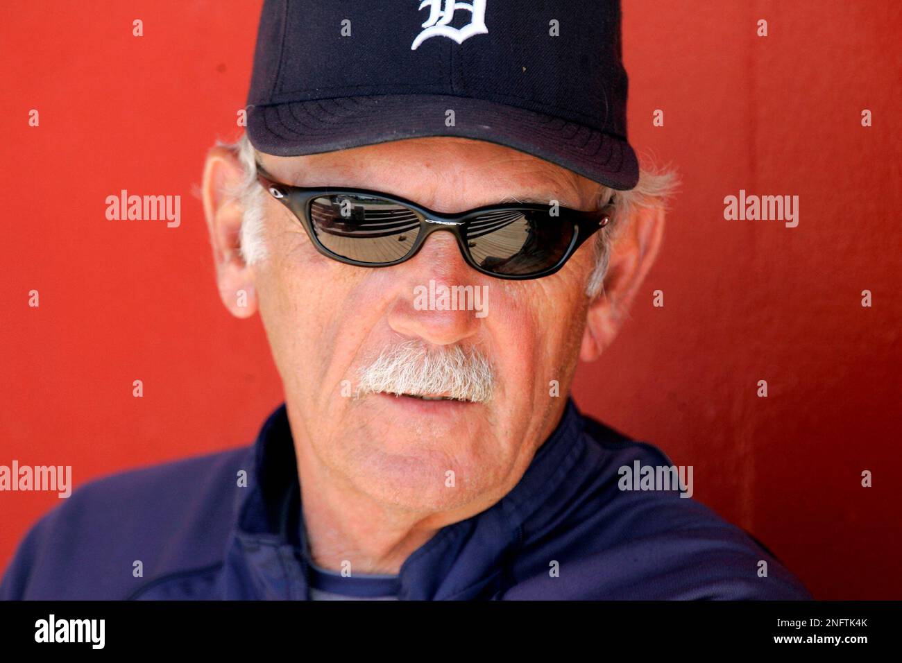 Detroit Tigers manager Jim Leyland sits in the dugout during spring ...