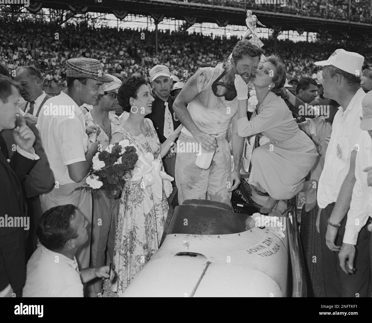 Pat Flaherty, Chicago, his face begrimed by the grueling Indianapolis ...