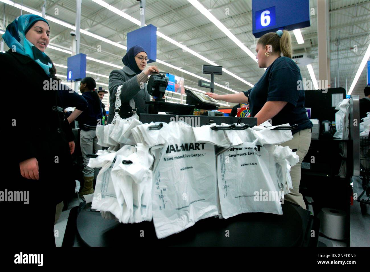 Zeinab Bazzi, left, and Faten Saad check out at Wal-Mart in Dearborn ...