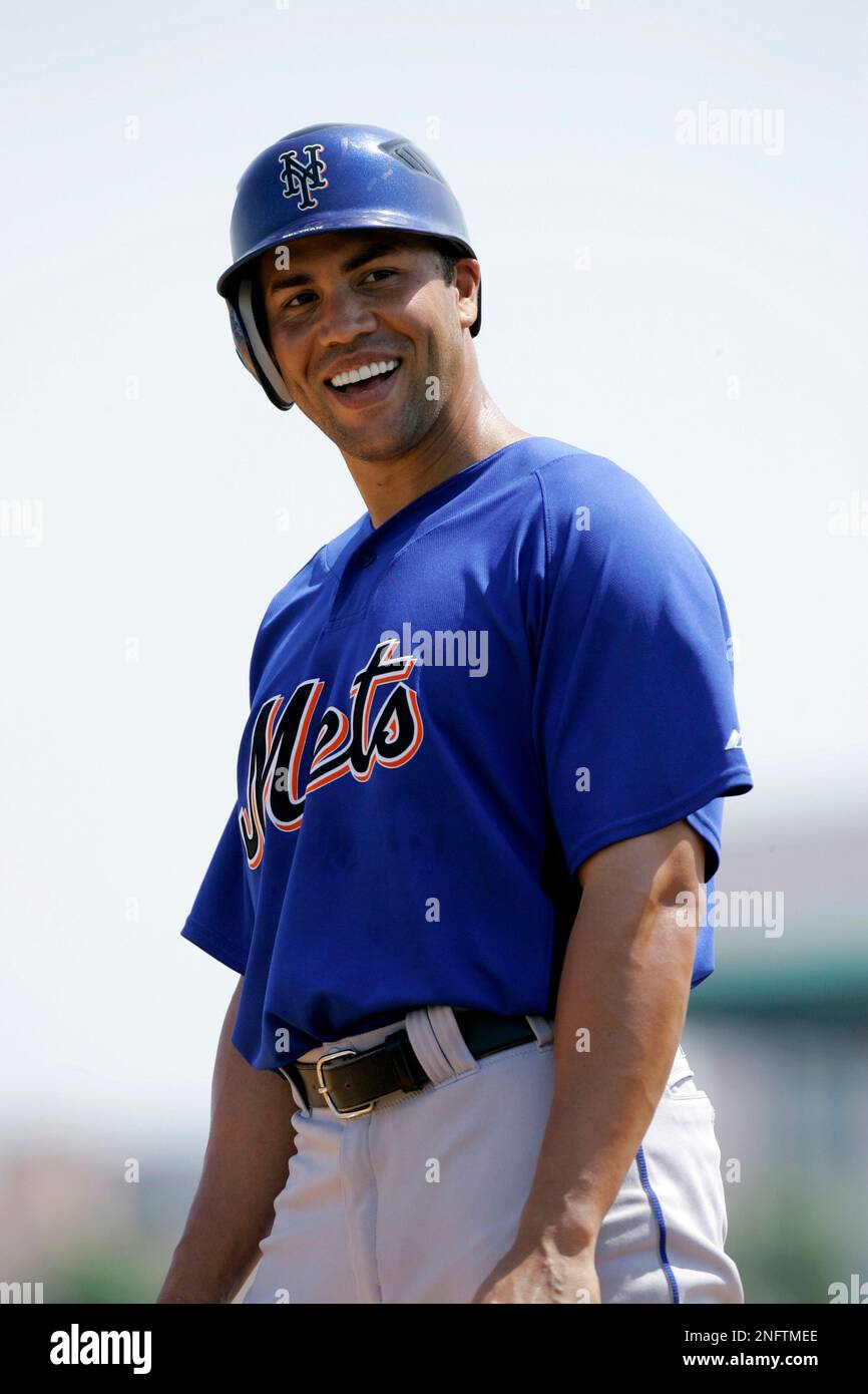 New York Mets' Carlos Beltran looks over at the Florida Marlins dugout ...